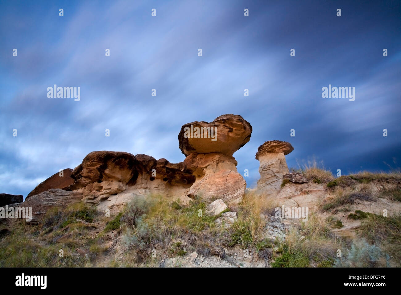 Fast moving clouds pass over hoodoos in Dinosaur Provincial Park in ...
