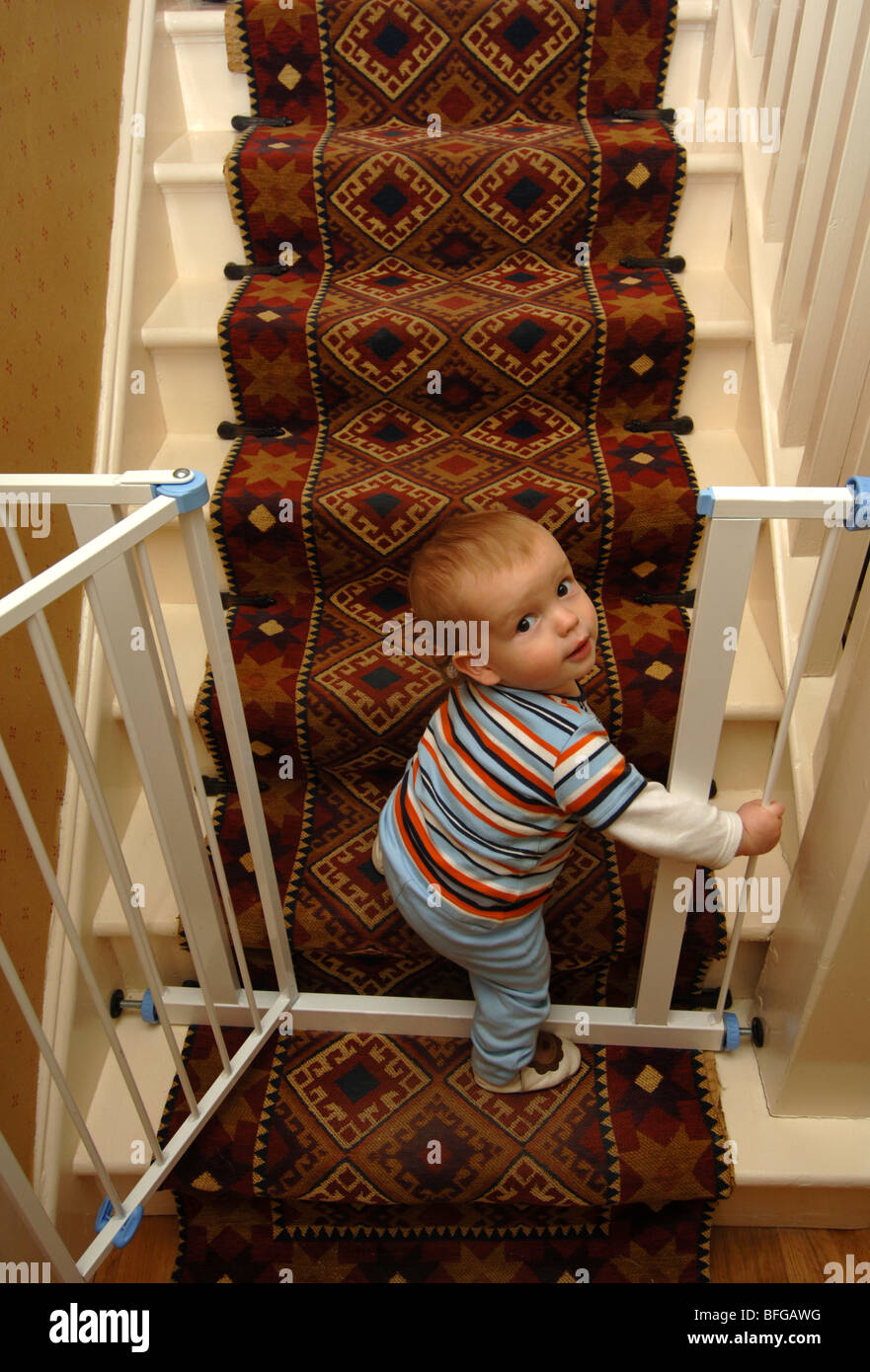 Child climbing stairs, toddler climbs staircase, baby boy on steps with ...