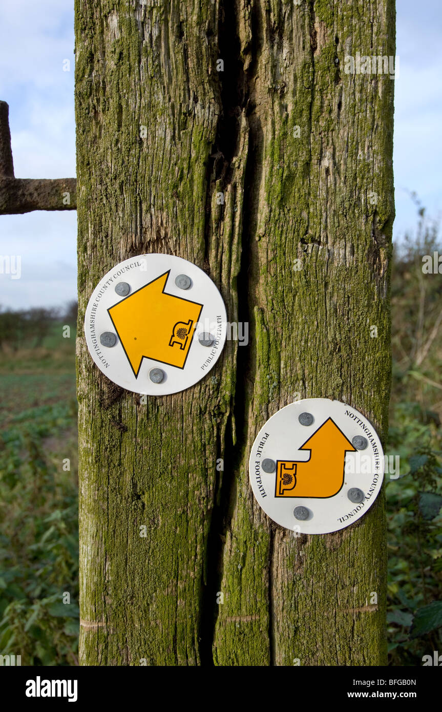 Post arrows showing direction of public footpaths Stock Photo - Alamy