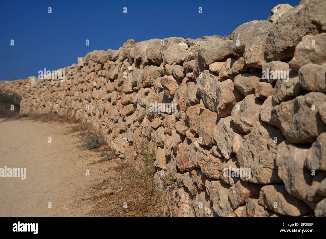 old ancient town wall at the unesco archeological park in paphos ...