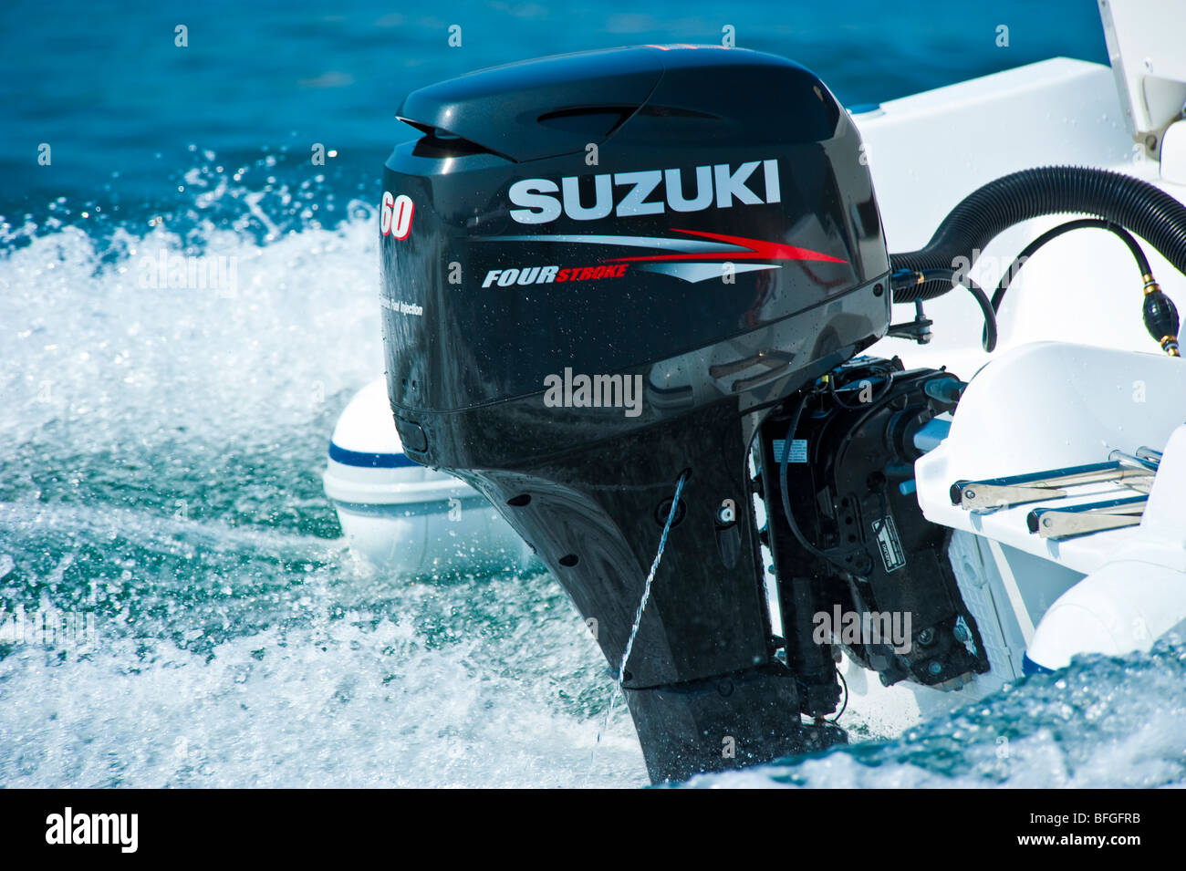 New 2009 model of Suzuki DF 60 outboard engine on power boat transom ...