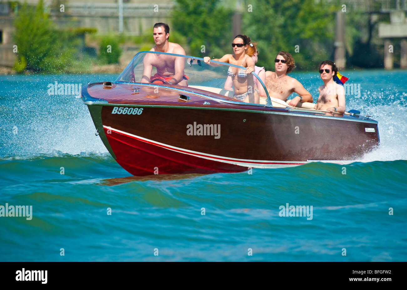 Classical wooden power boat, Poncelet 580 with people having fun in ...