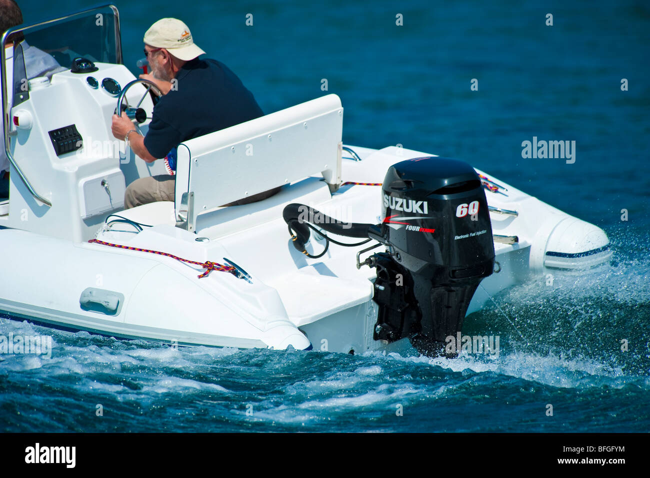 New 2009 model of Suzuki DF 60 outboard engine on power boat transom ...