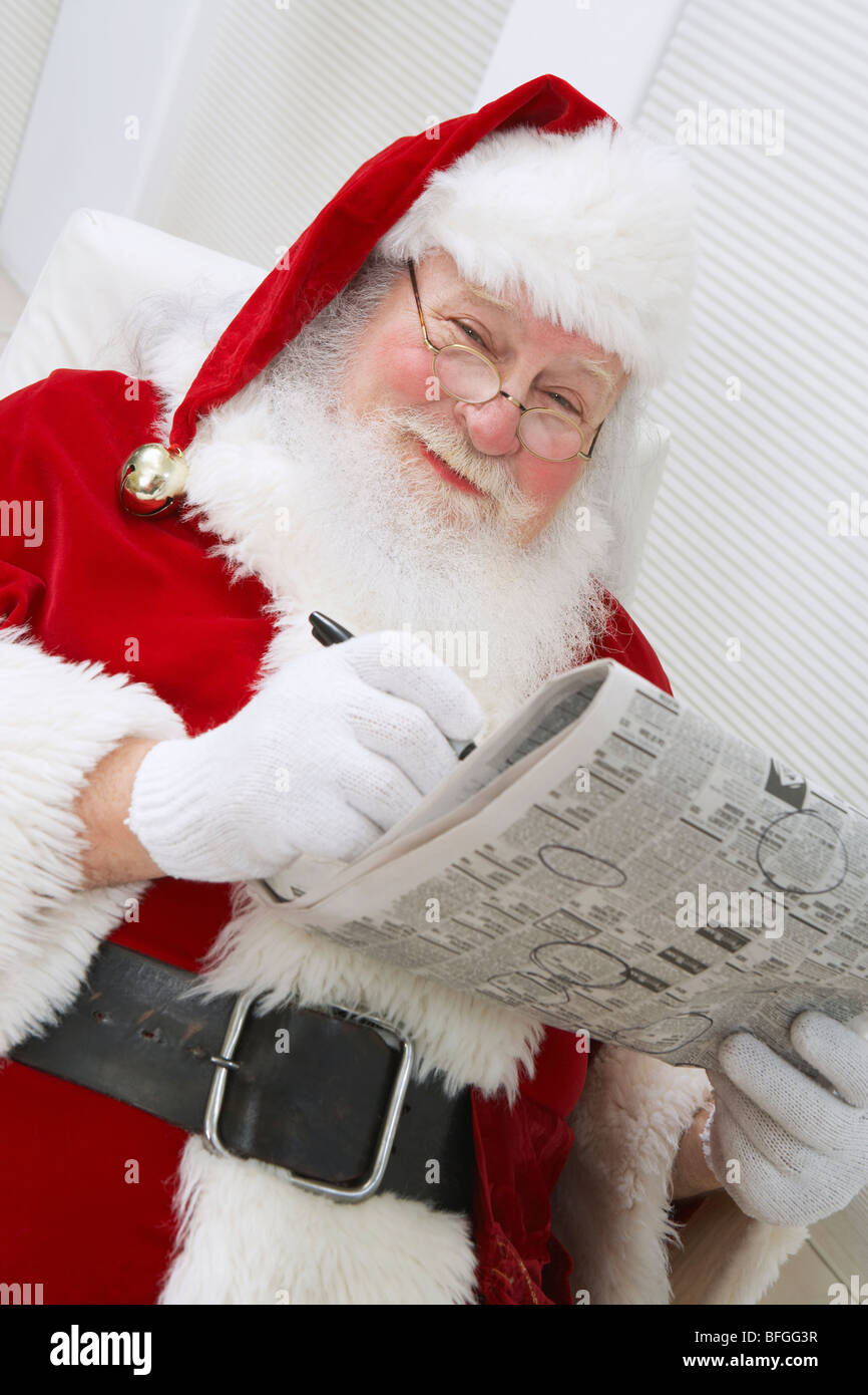 Santa Claus Reading Newspaper Stock Photo - Alamy