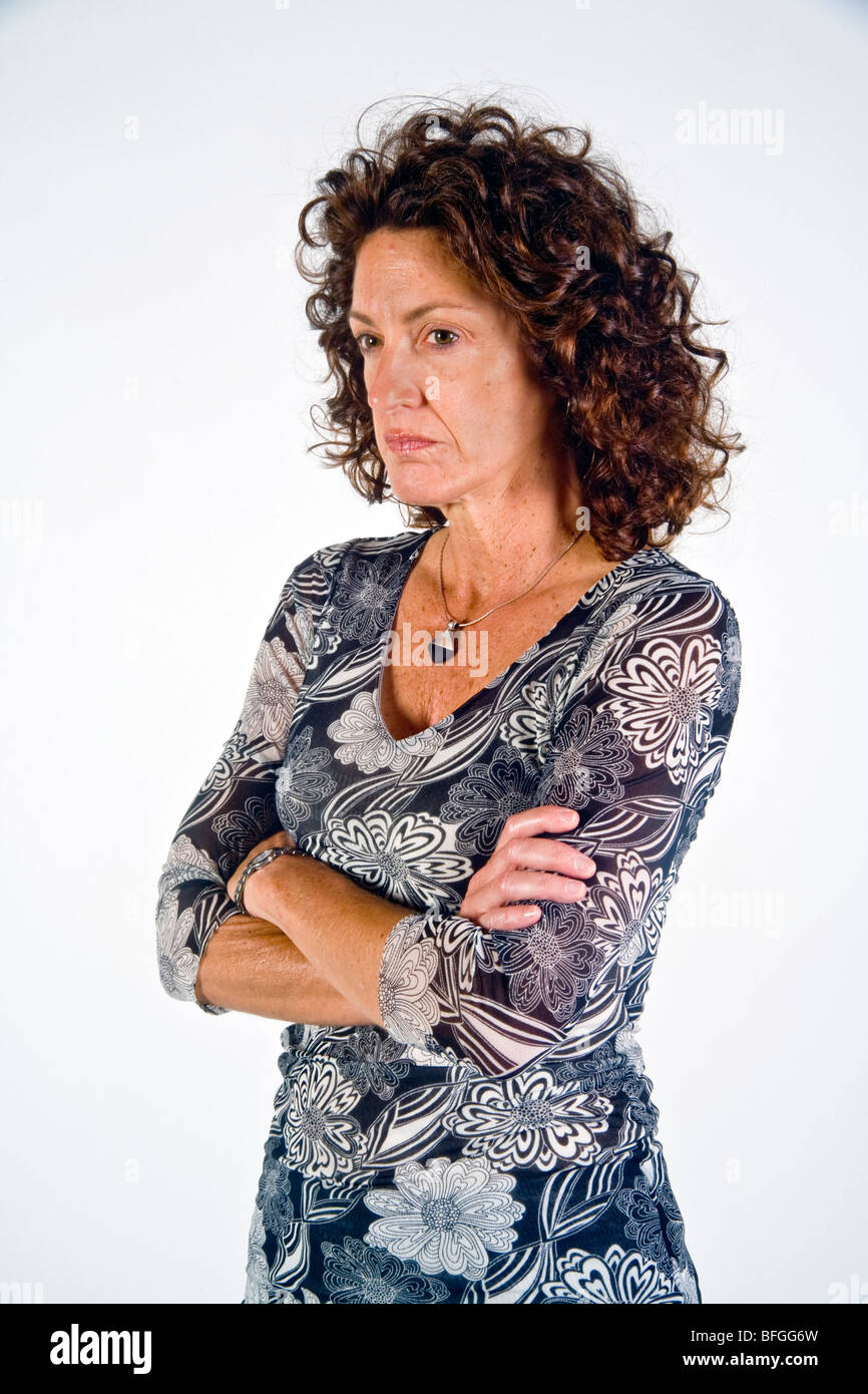 Standing with arms crossed on her chest indicates a defensive mood in ...