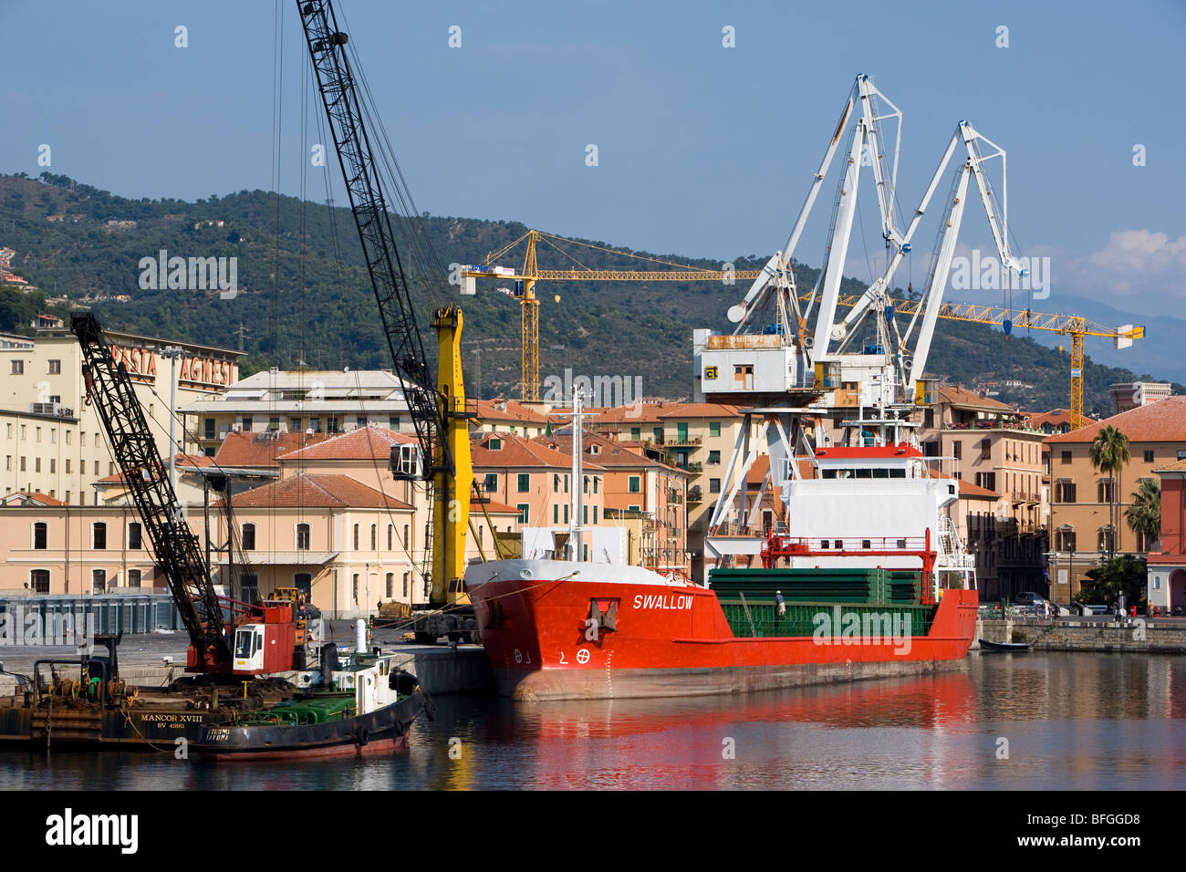 Cargo ship unloading at Imperia, liguria, Italy Stock Photo - Alamy