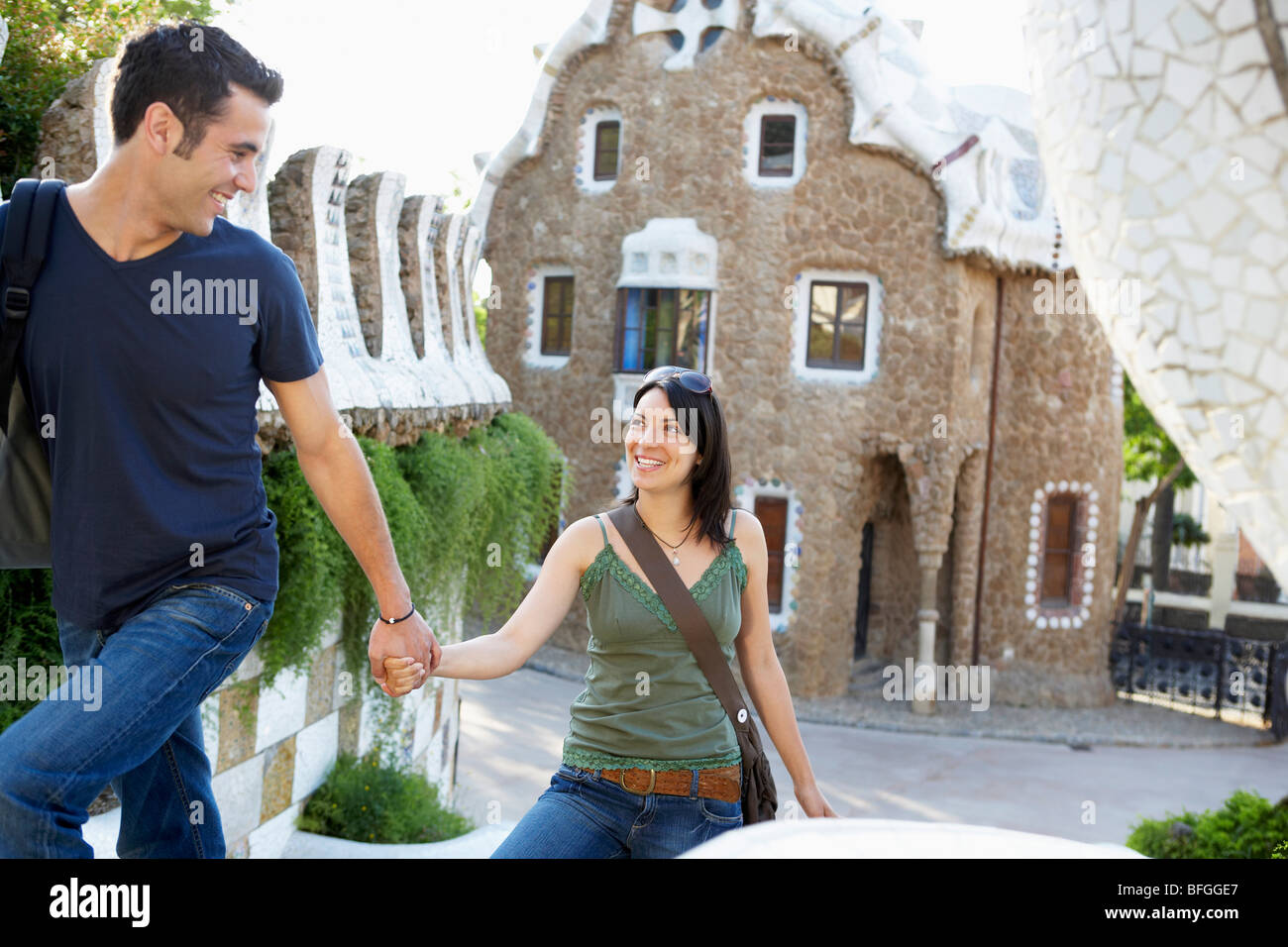 Young couple sightseeing, holding hands Stock Photo - Alamy