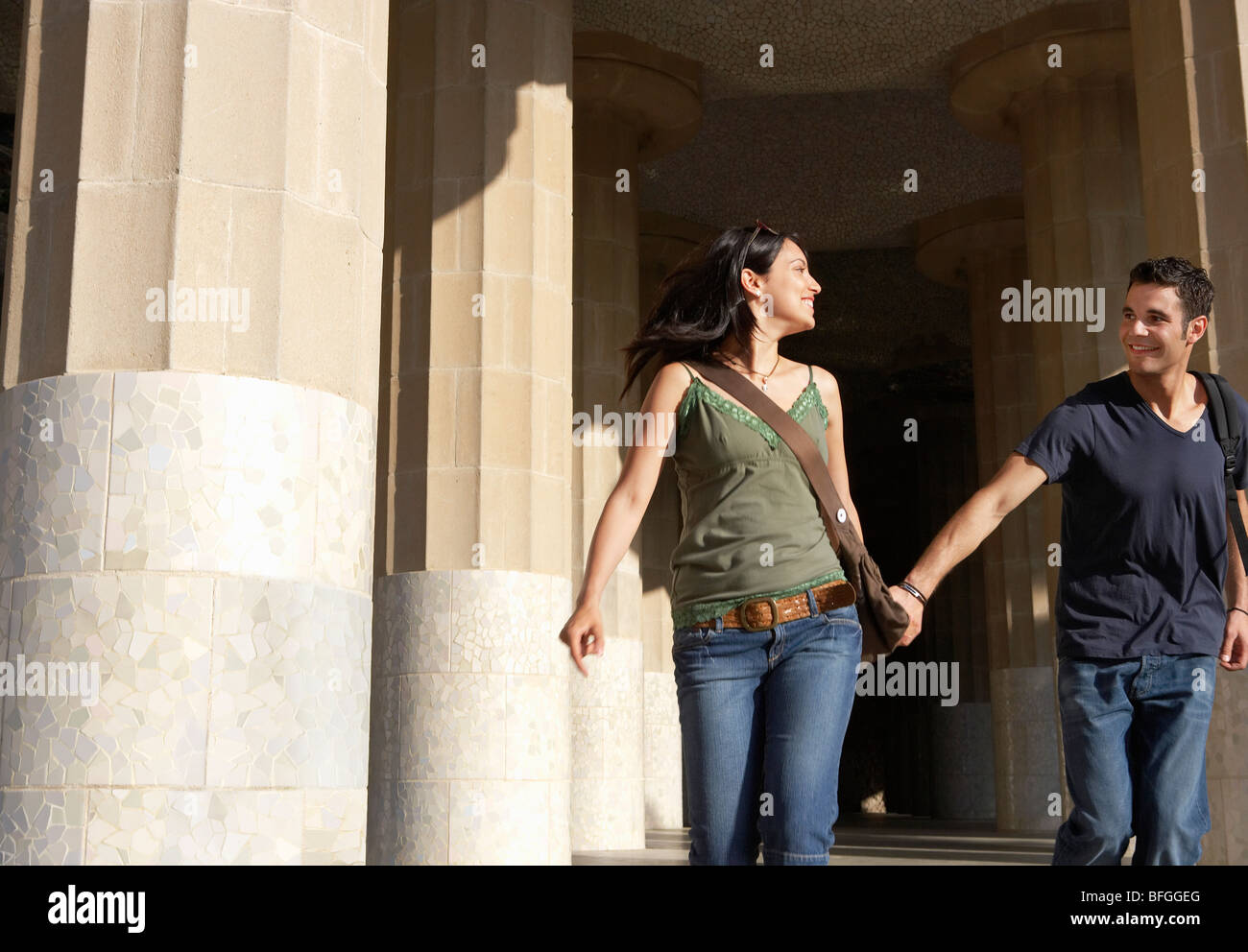Young couple sightseeing, holding hands Stock Photo - Alamy