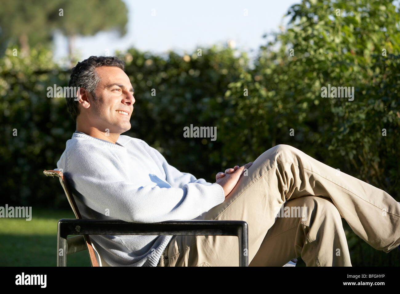 Man Relaxing in Garden Stock Photo - Alamy