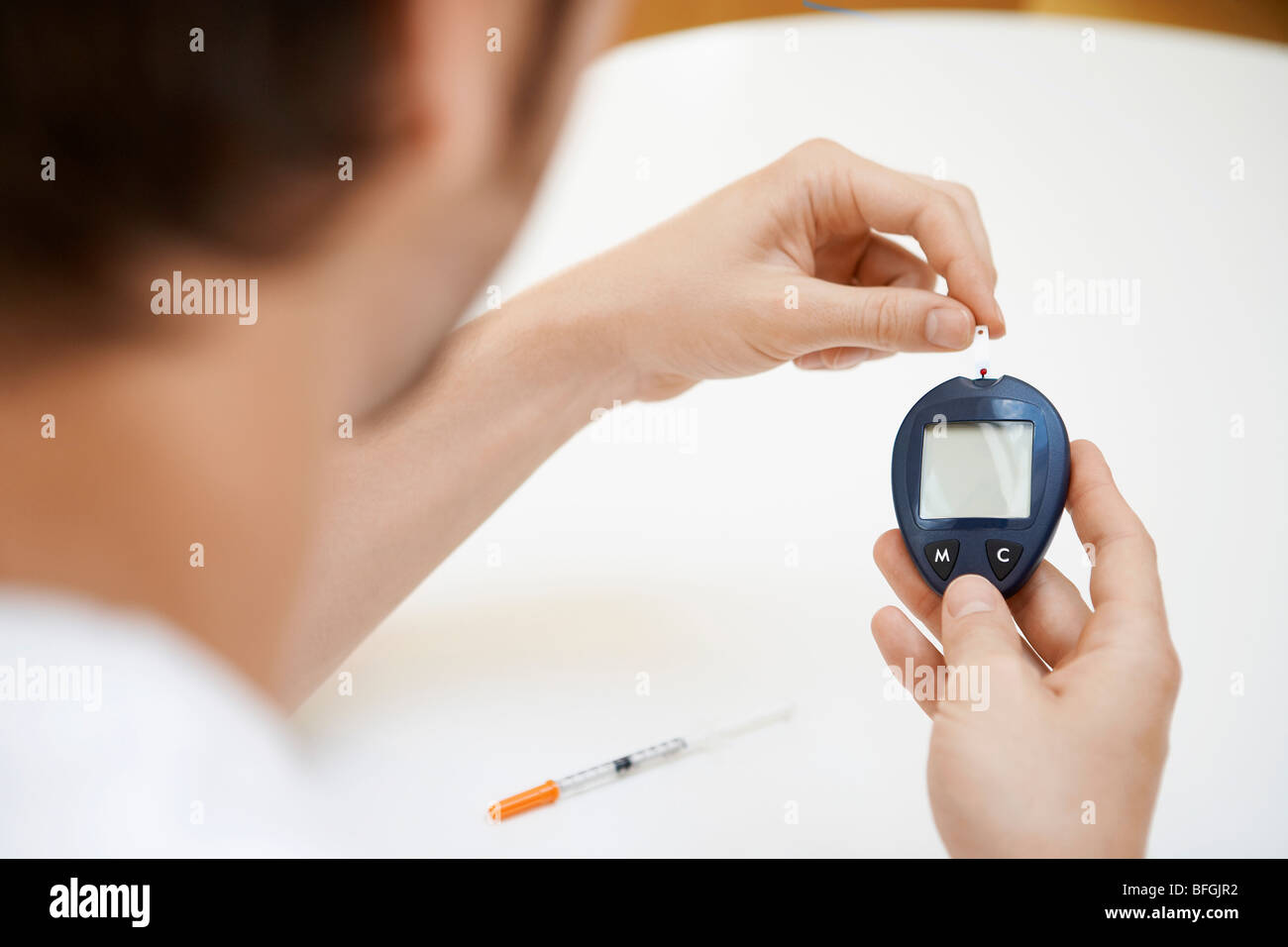 Person using glucose meter hi-res stock photography and images - Alamy