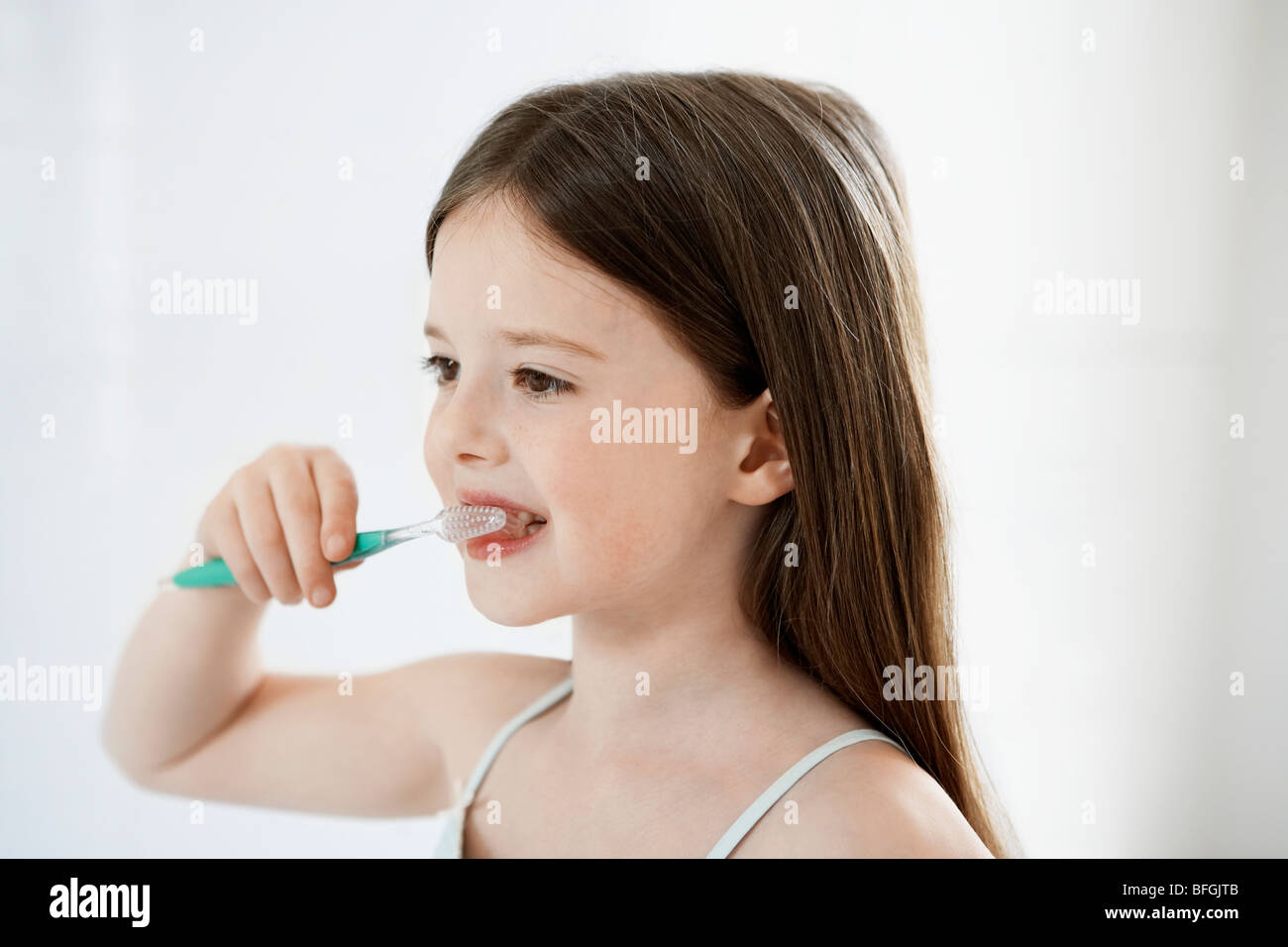 Girl Brushing Teeth in bathroom, close up Stock Photo - Alamy
