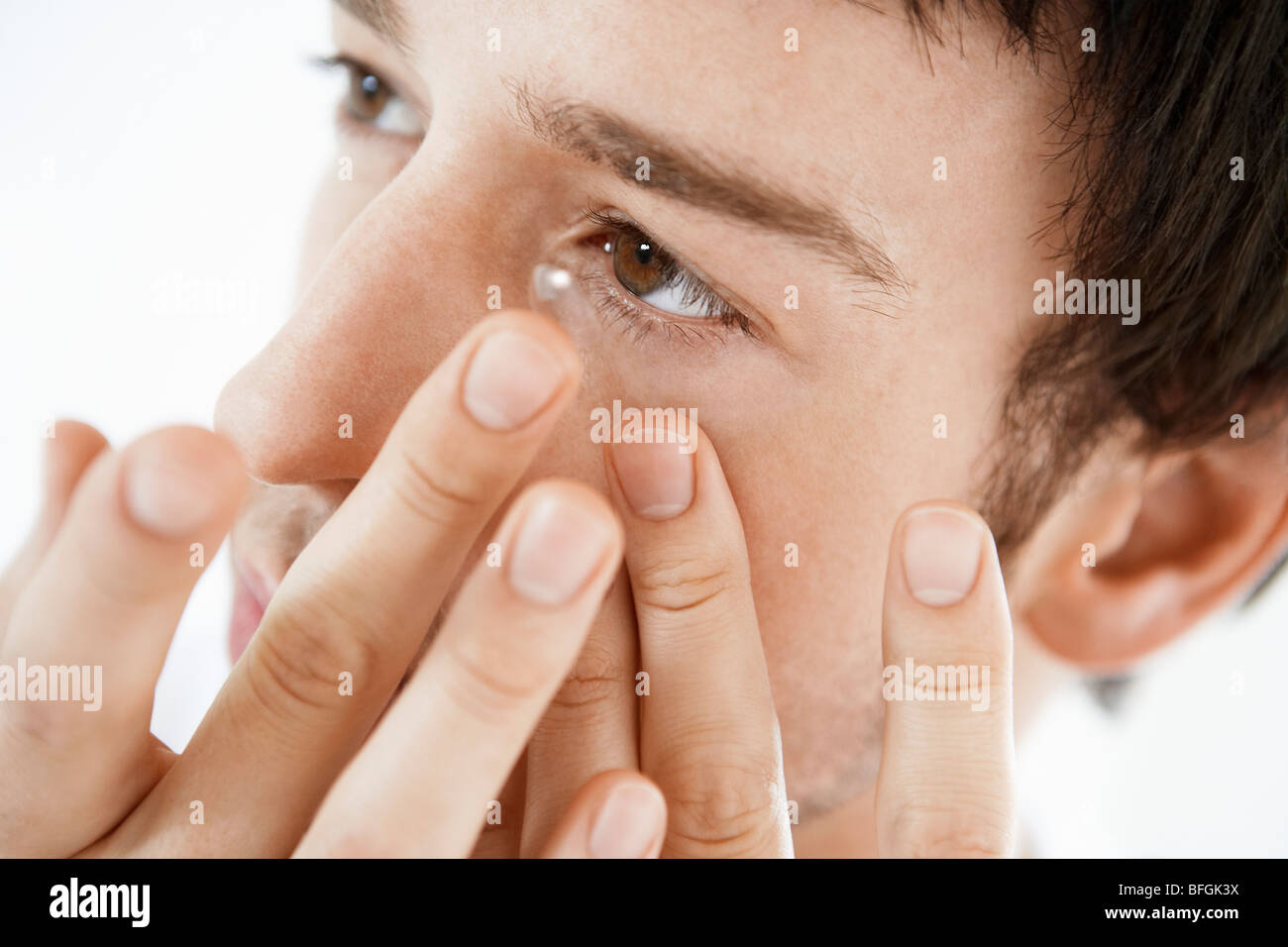 Man inserting contact lens, close up Stock Photo - Alamy