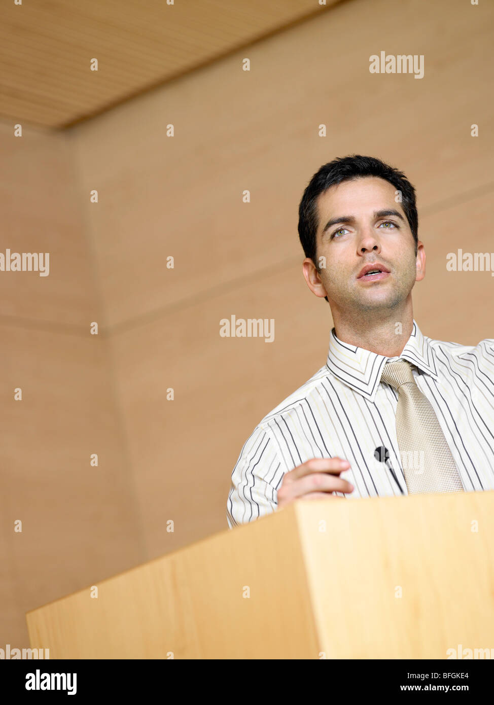 Businessman talking at podium in conference room Stock Photo - Alamy