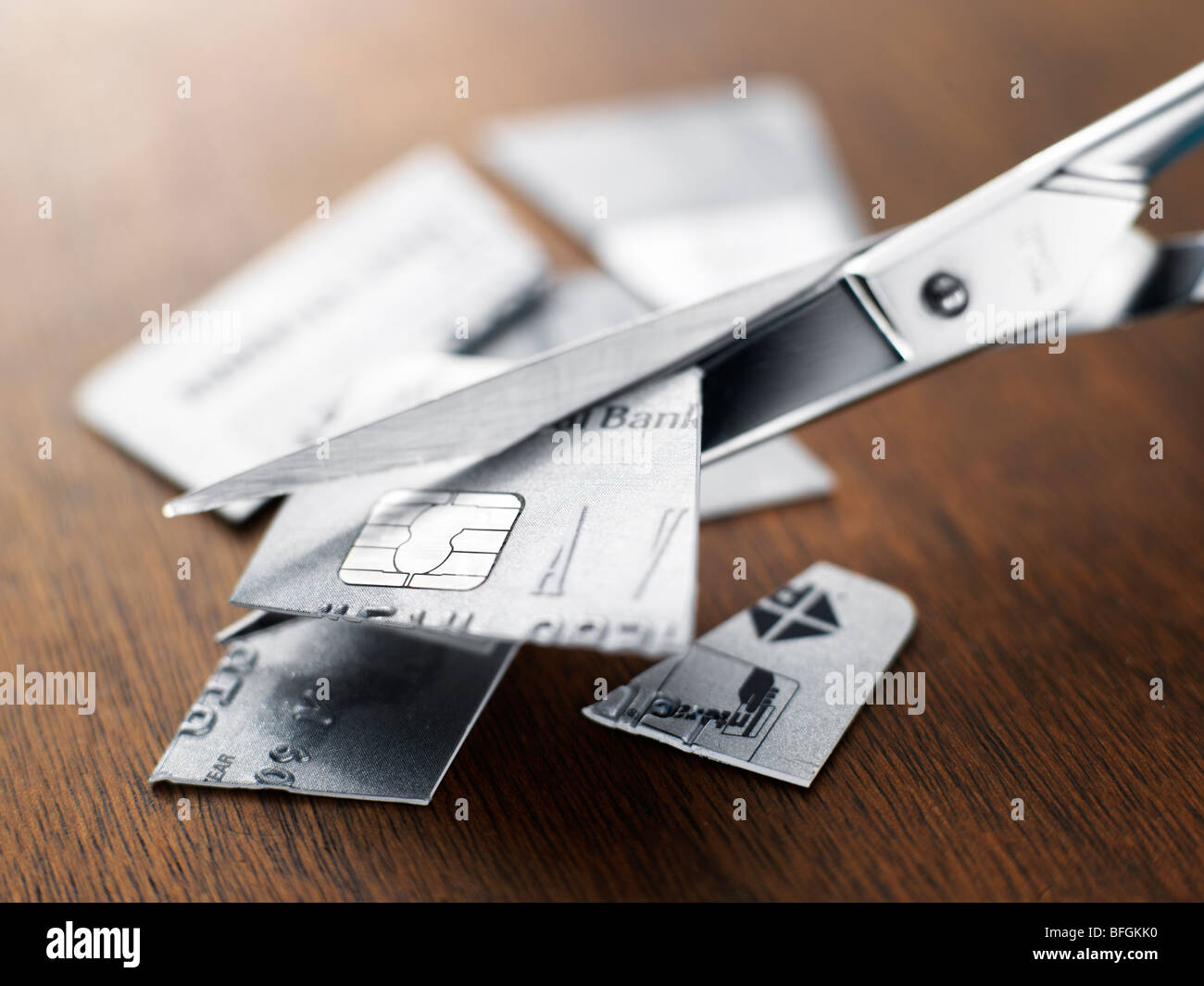 Credit card being cut up with a scissors Stock Photo - Alamy