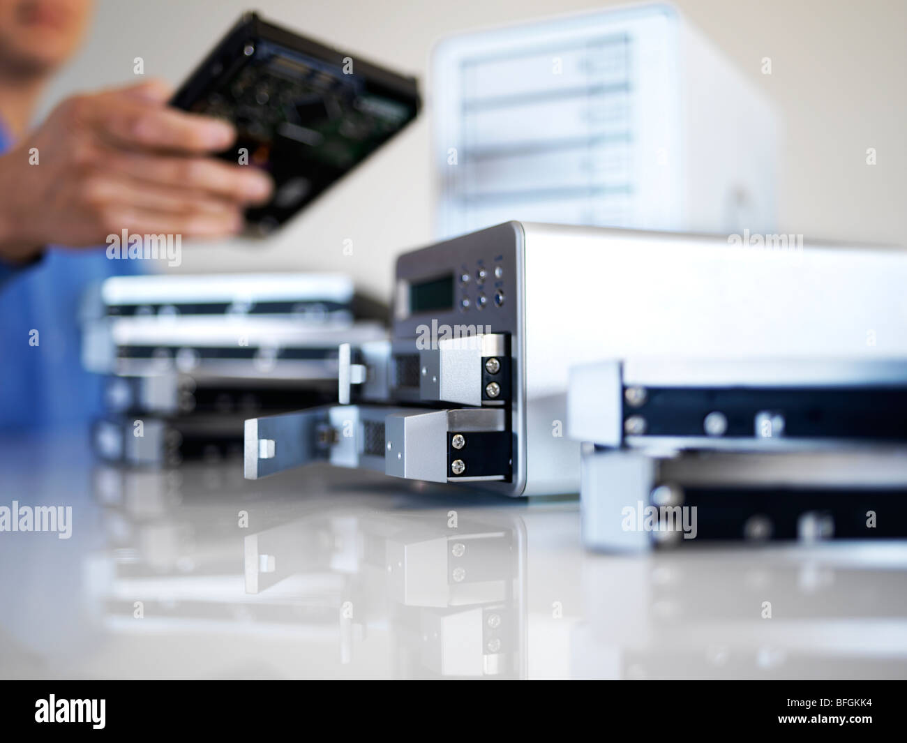 Person using a RAID (Redundant Array of Independent Disks) hard drive ...