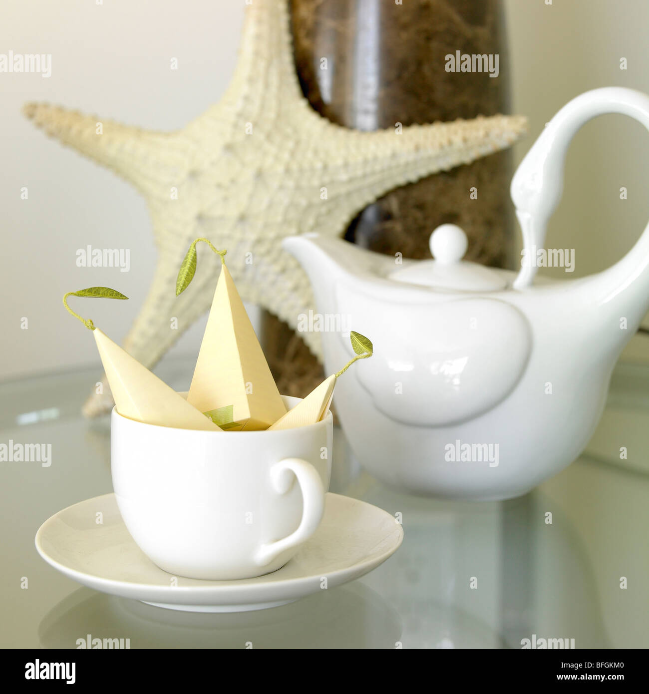 Tea cup with tea packets on a table Stock Photo - Alamy