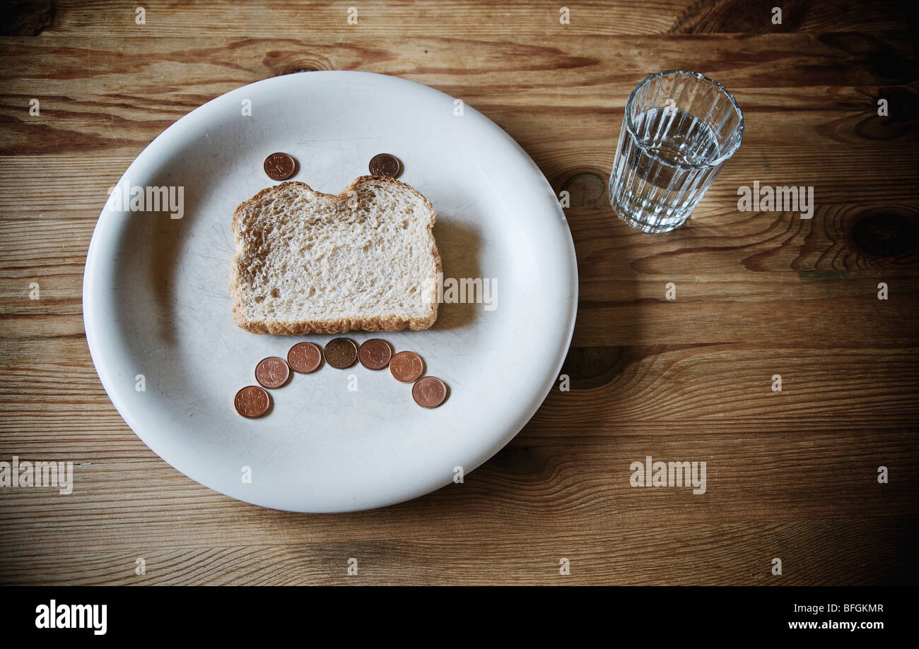 Glass of water and sad face made out of a slice of stale bread and ...