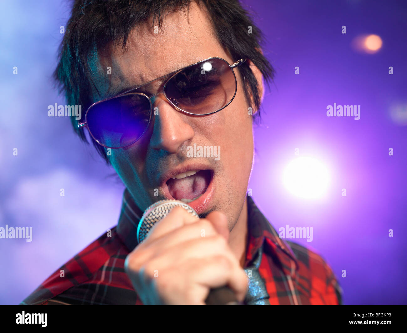 Rock Singer Performing on Stage Stock Photo - Alamy