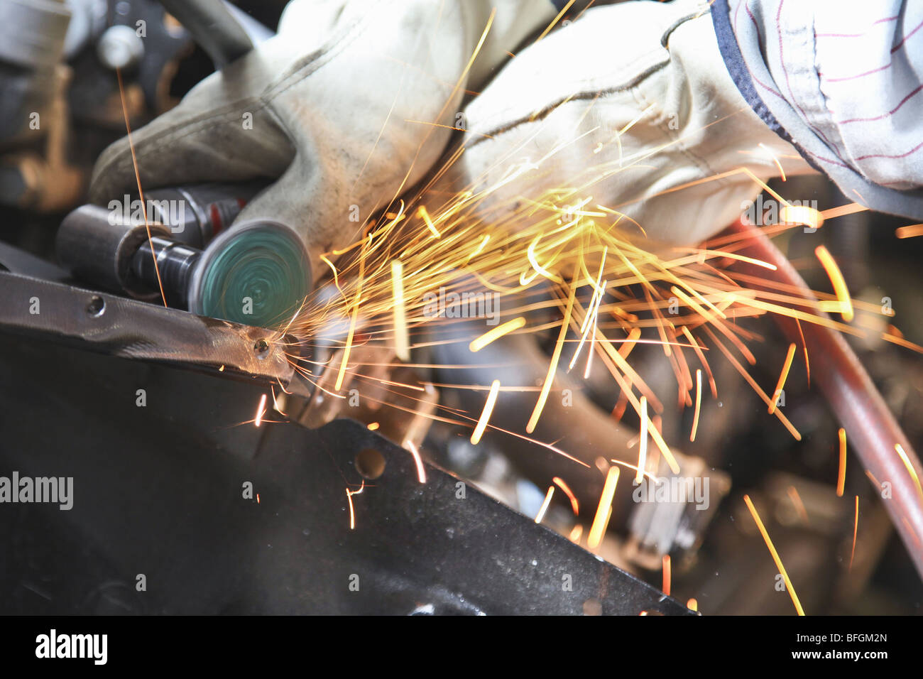 Metal grinding in an autobody shop with an air die grinder Stock Photo ...