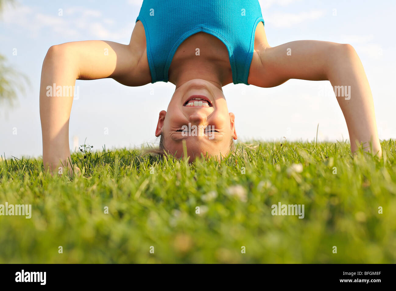 Child doing headstand hi-res stock photography and images - Alamy