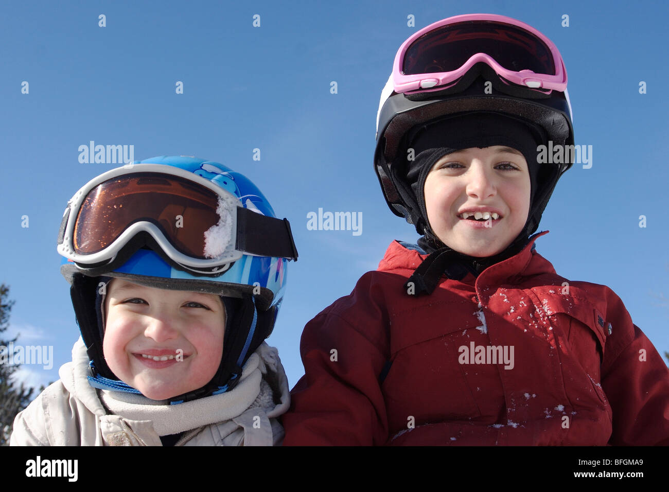 Brother and sister wearing ski helmet and goggles, King City, Ontario ...