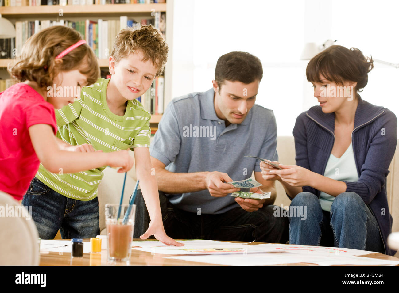 Parents children money calculator hi-res stock photography and images ...