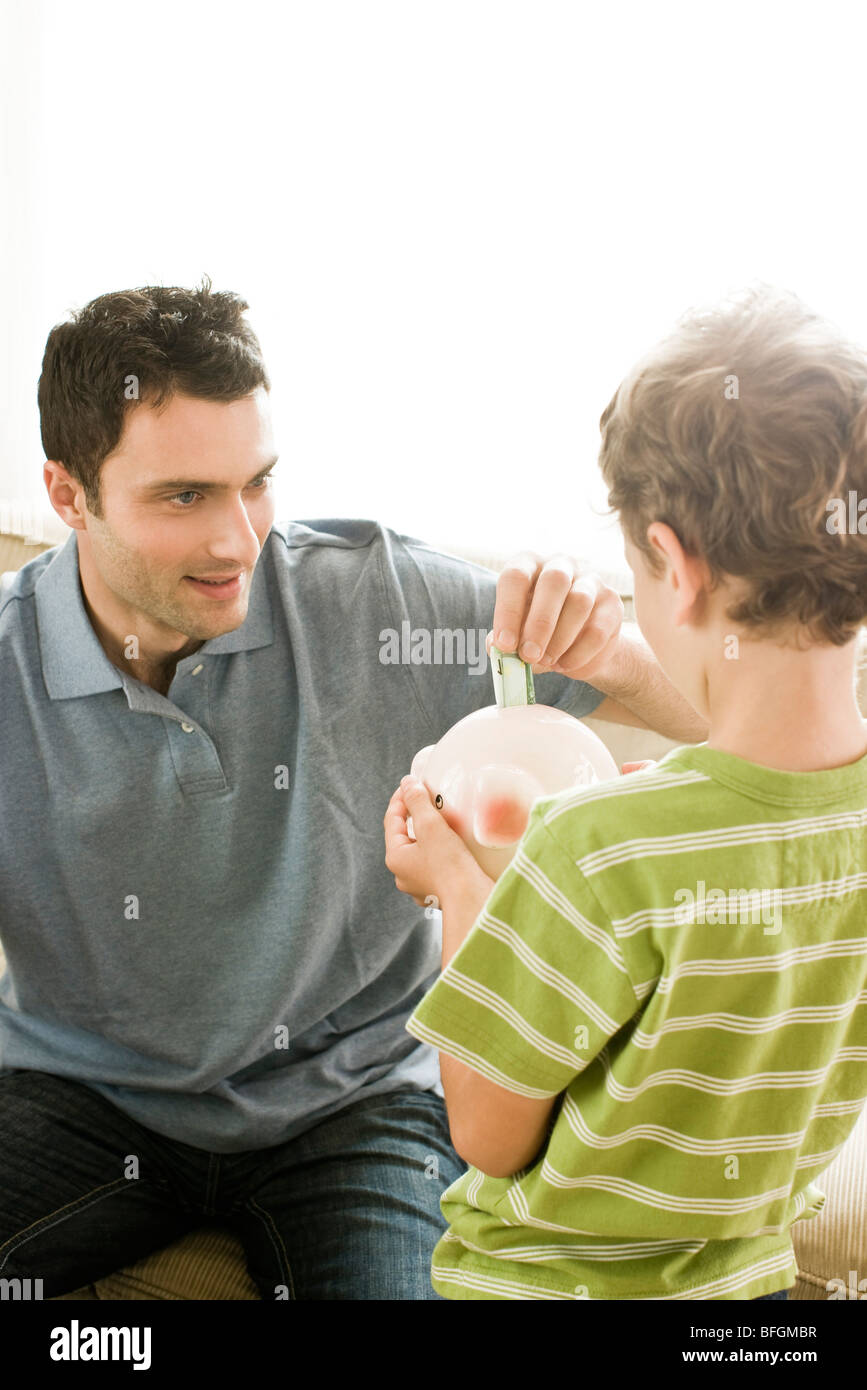 Parent giving money to adult child hi-res stock photography and images ...