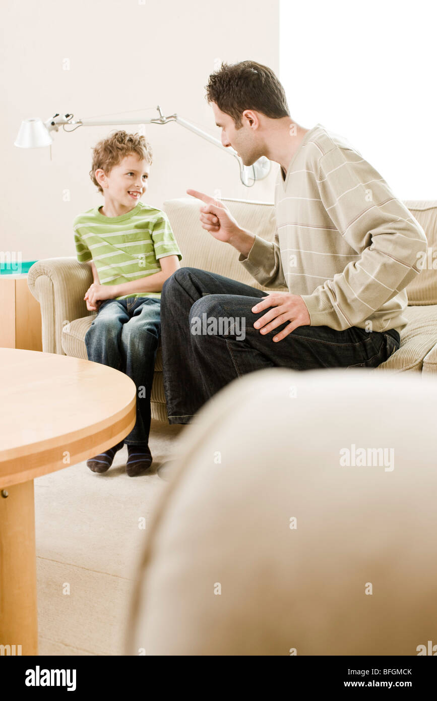 father talking seriously with son Stock Photo - Alamy