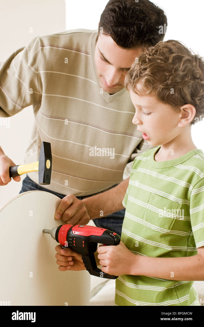 Father son fixing table hi-res stock photography and images - Alamy