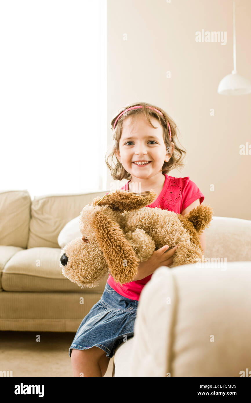 cheerful girl holding stuffed dog Stock Photo - Alamy