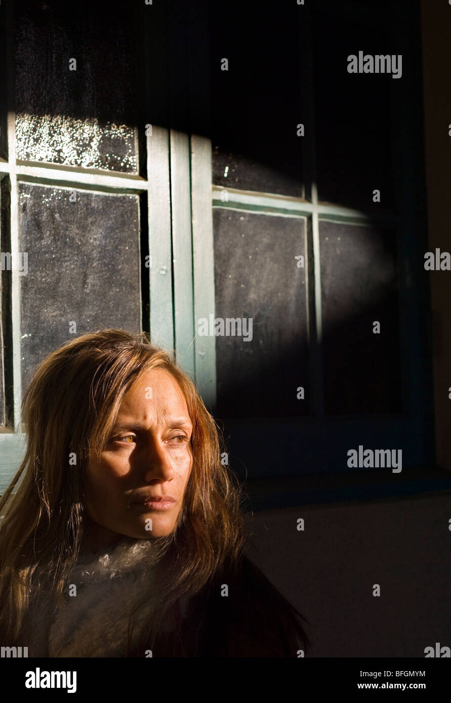 Portrait of woman standing in harsh afternoon sunlight, Balboa Park ...