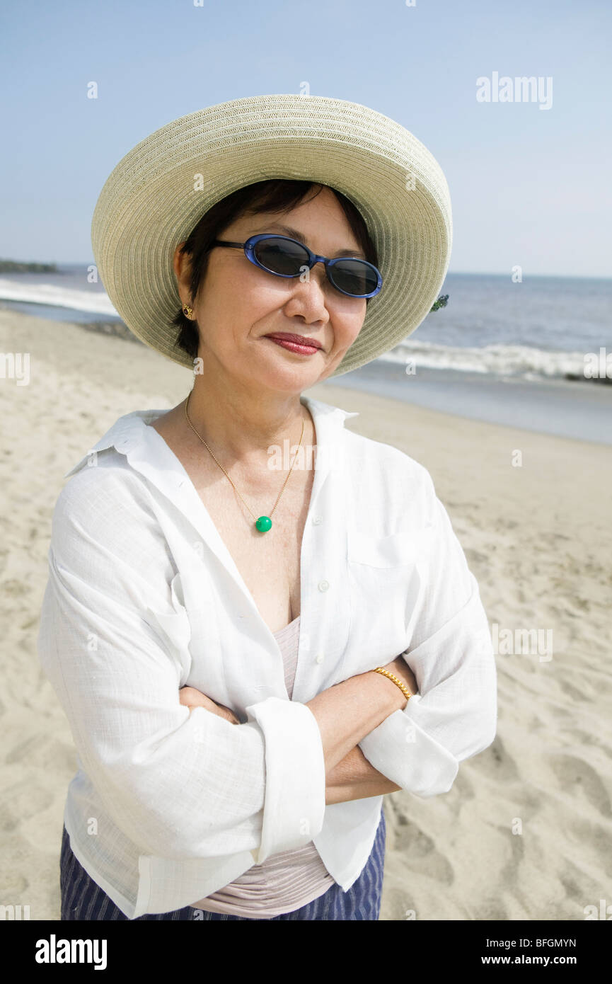 Middle-aged woman on beach Stock Photo - Alamy