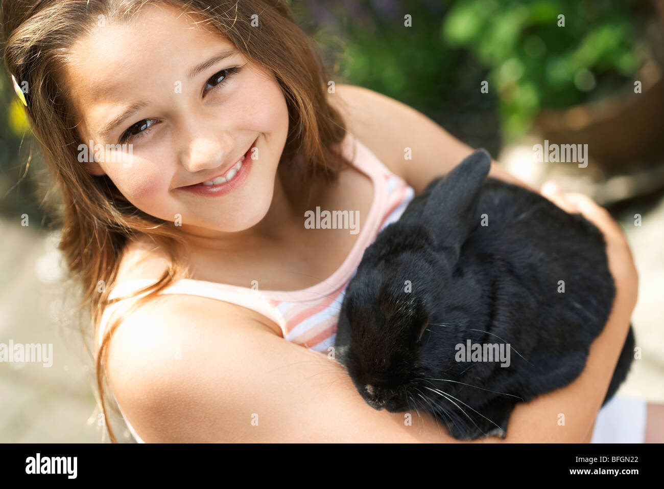 Girl Holding Rabbit Stock Photo - Alamy