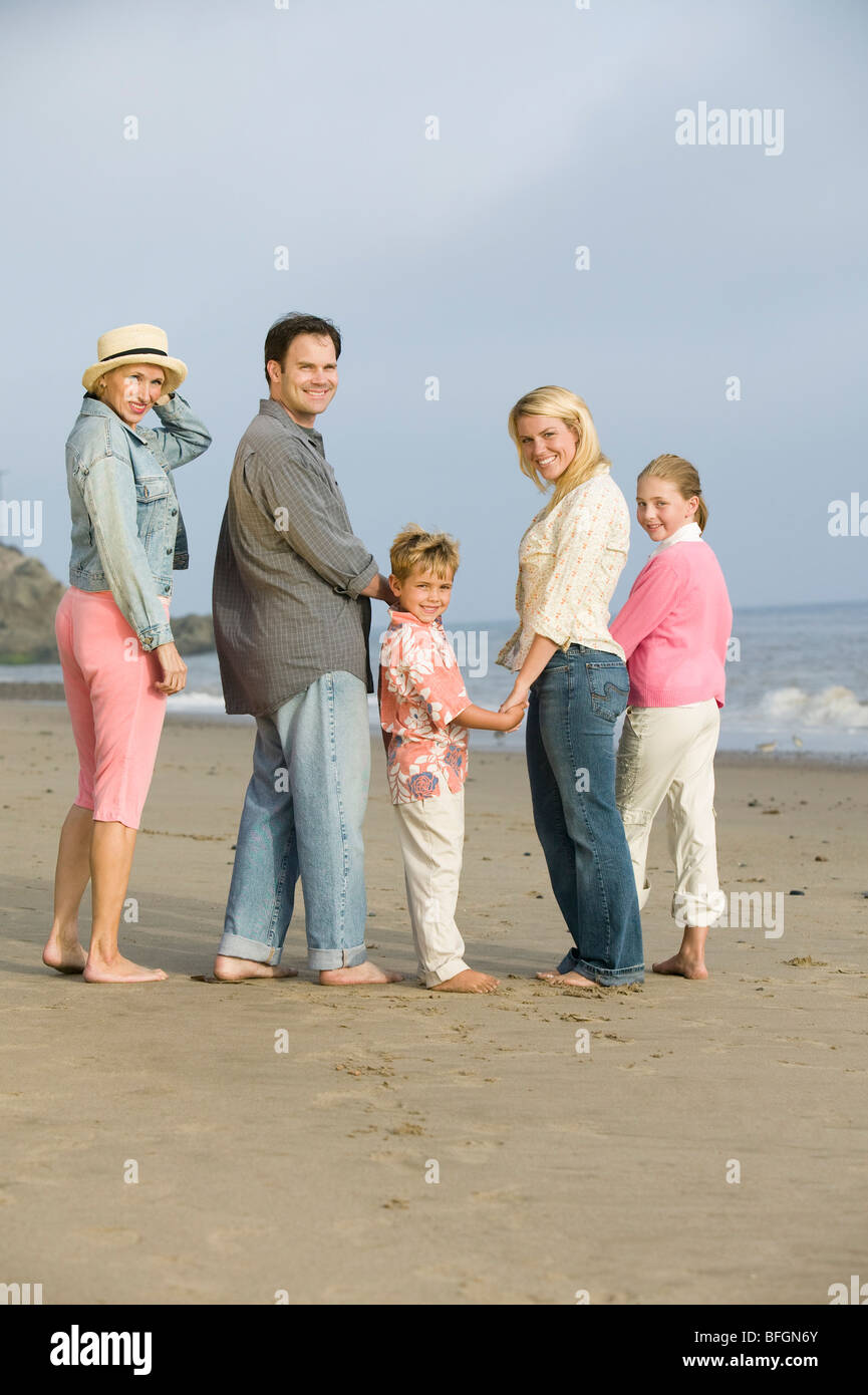 Family standing on beach, portrait Stock Photo - Alamy