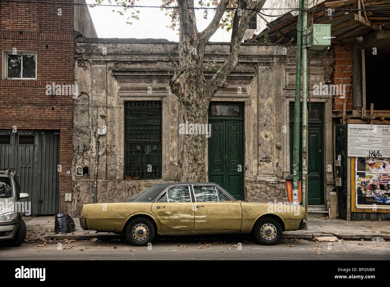 Old car parked in front of decrepit building, Buenos Aires, Argentina ...