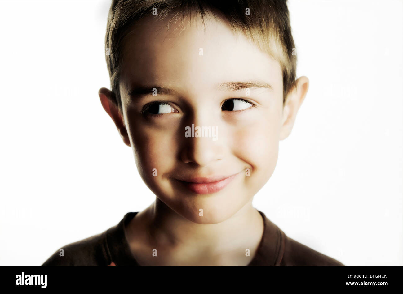 Boy short hair looking sideways hi-res stock photography and images - Alamy