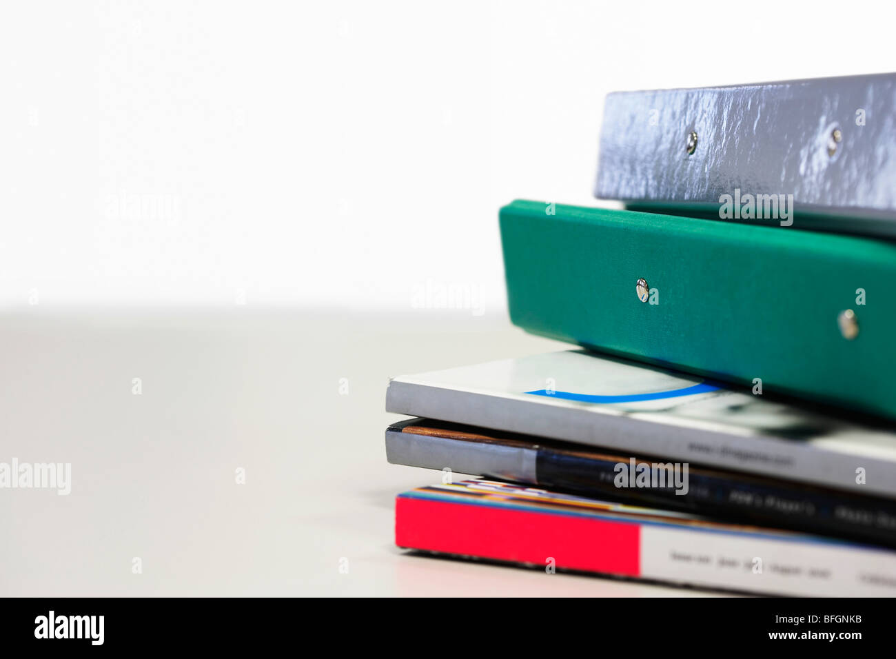 Stack of Magazines and Binders, close up Stock Photo - Alamy