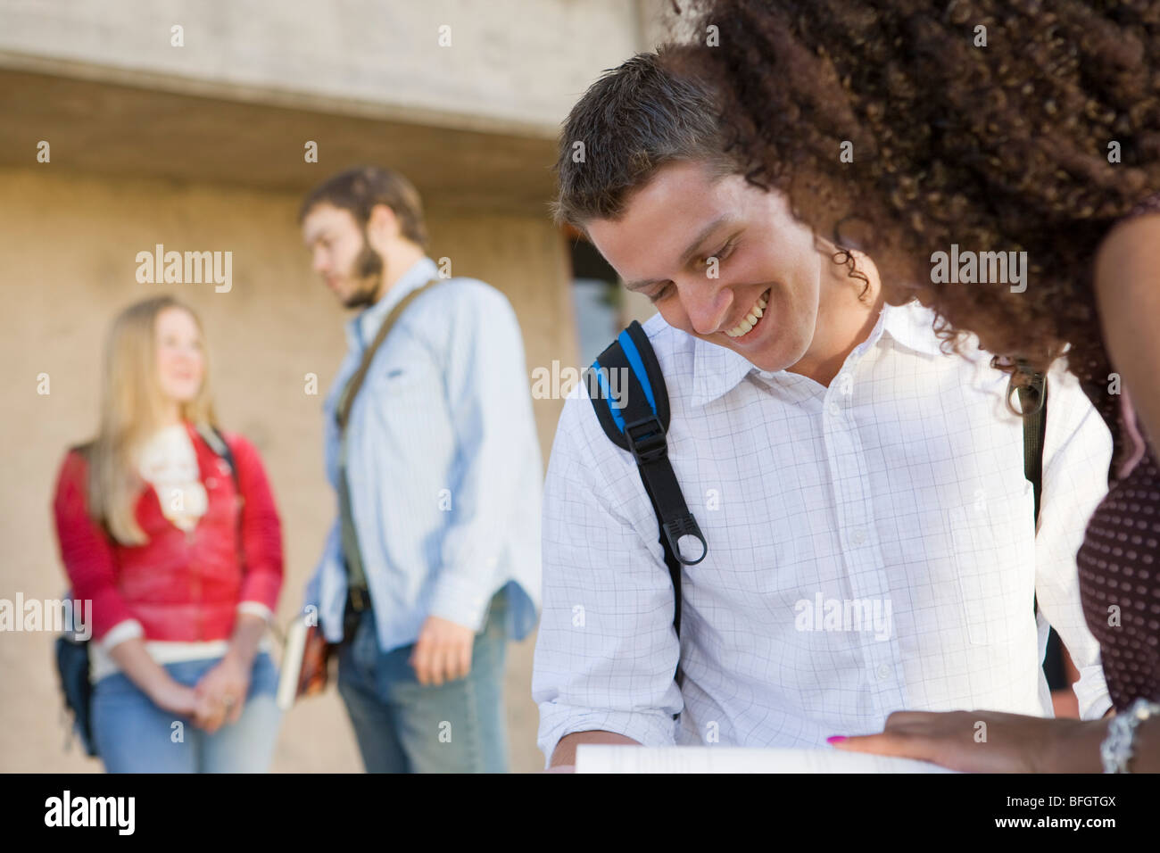 Young students having a break Stock Photo - Alamy