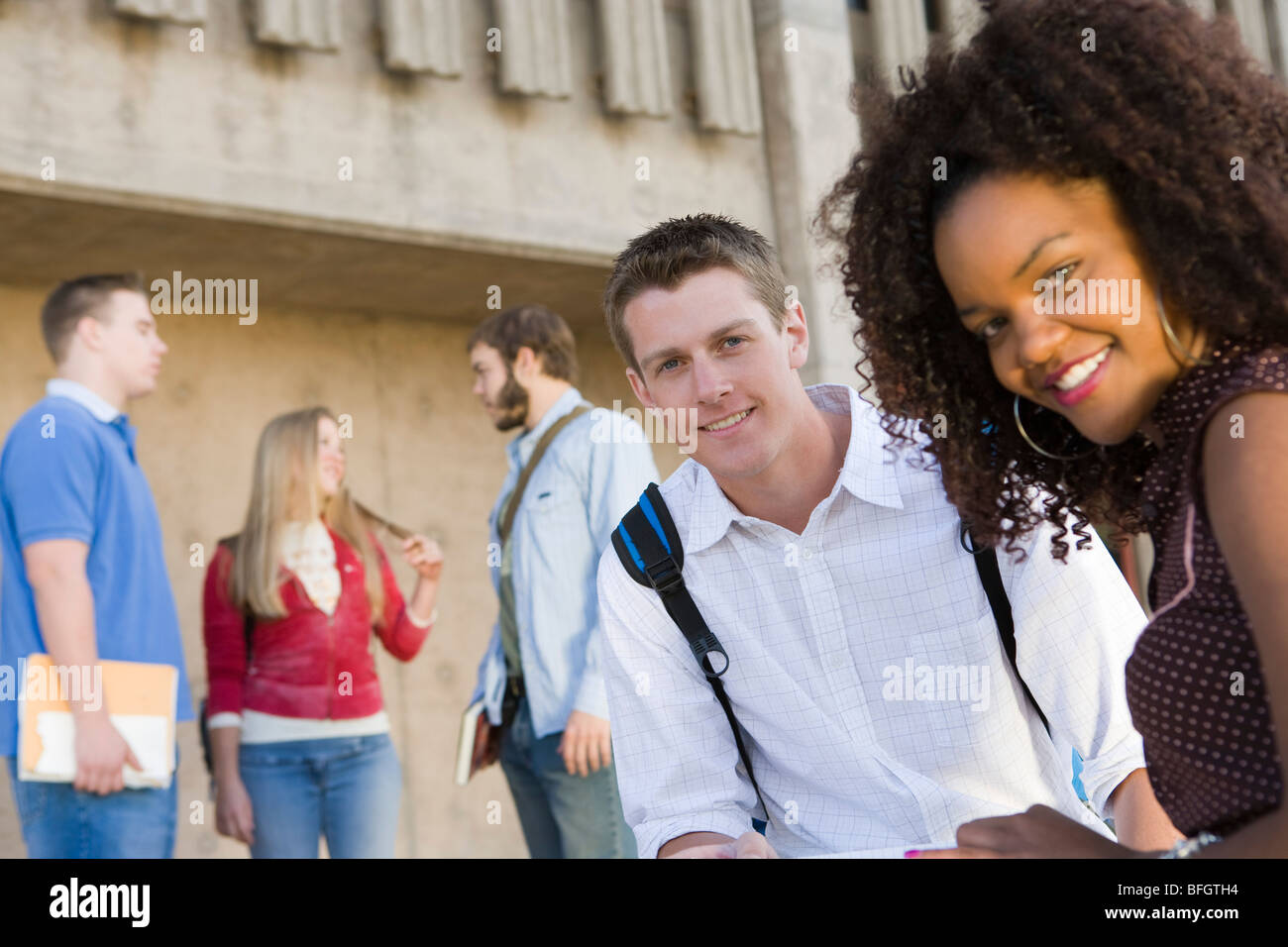 Young students having a break Stock Photo - Alamy