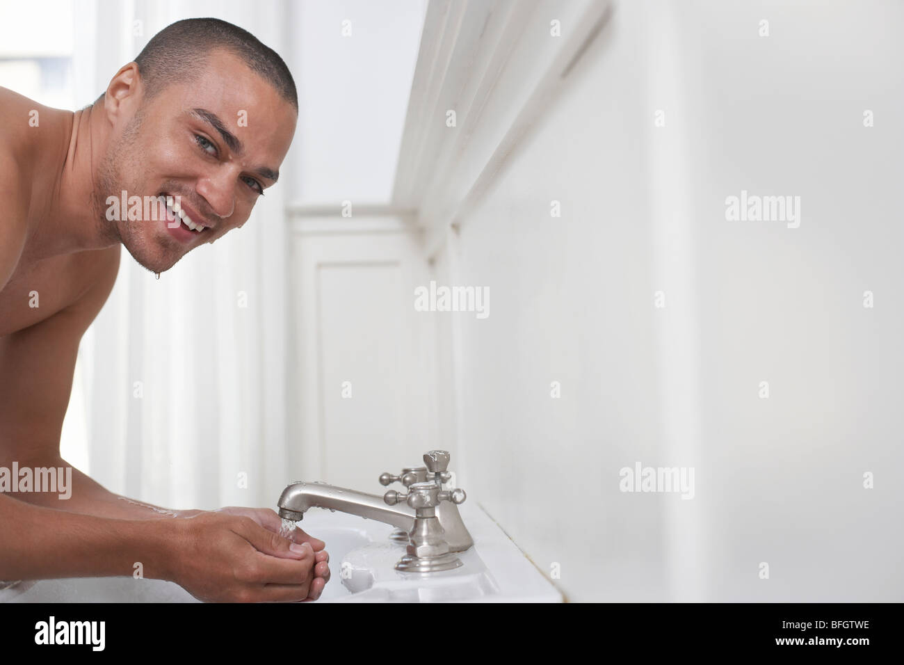 Young Man Washing in Basin Stock Photo - Alamy