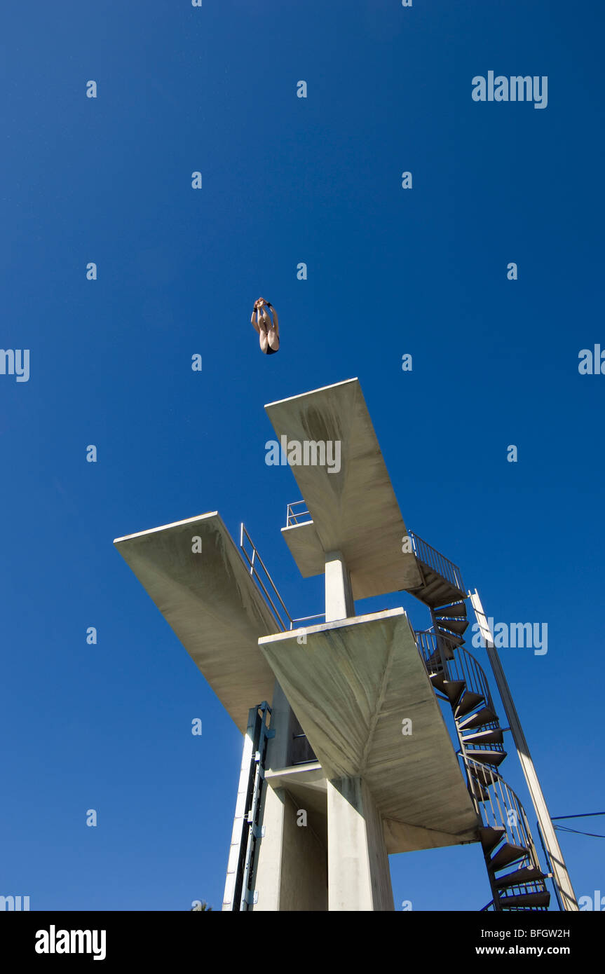 Swimmer diving from diving board Stock Photo - Alamy