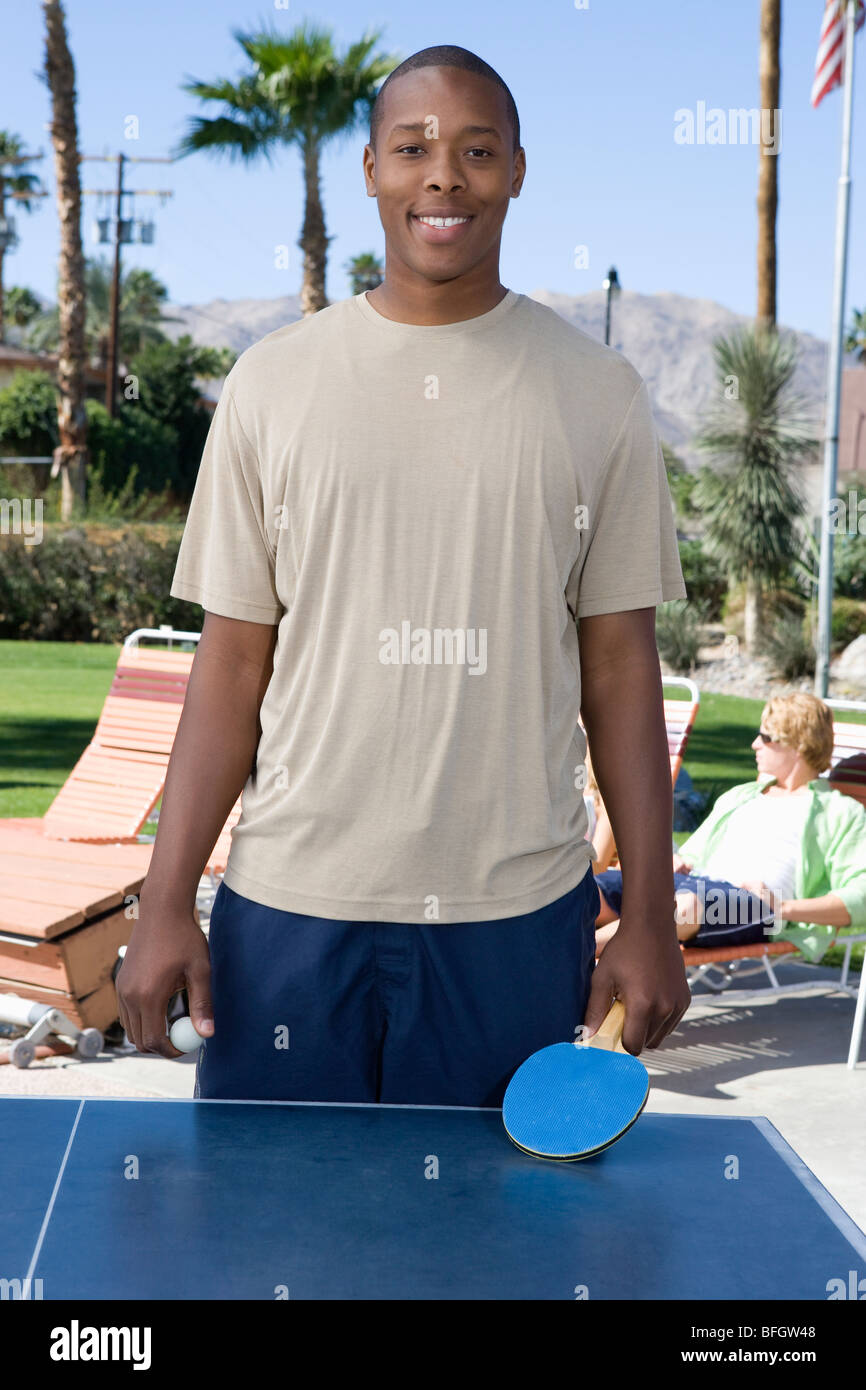 Young man playing table tennis, portrait Stock Photo - Alamy