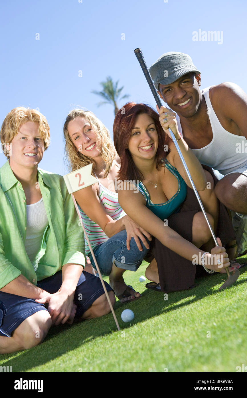 Four Young Friends on Golf Course, Portrait Stock Photo - Alamy
