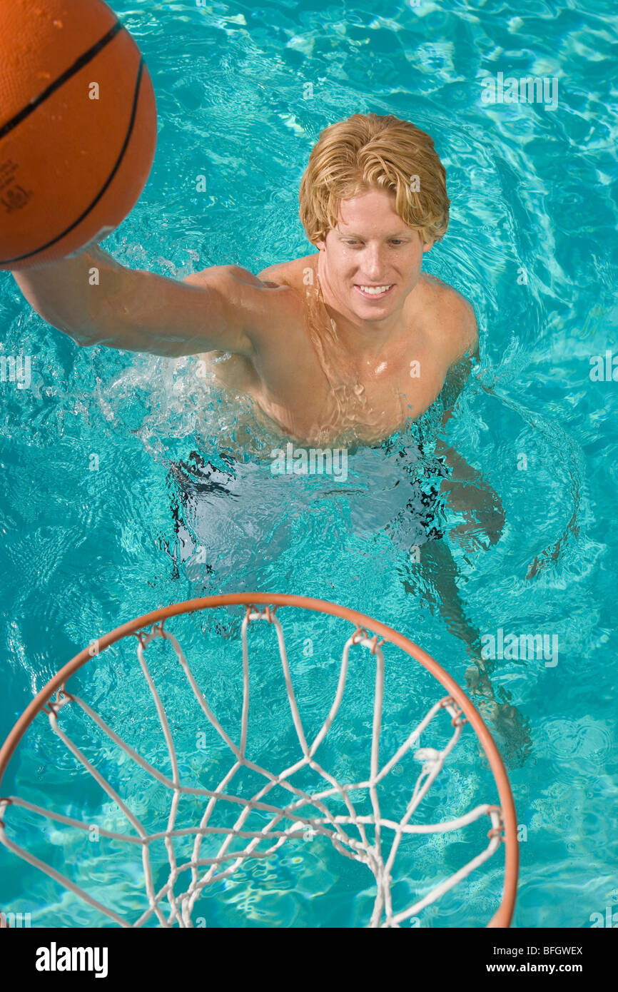 Young Man Playing Water Basketball Stock Photo - Alamy