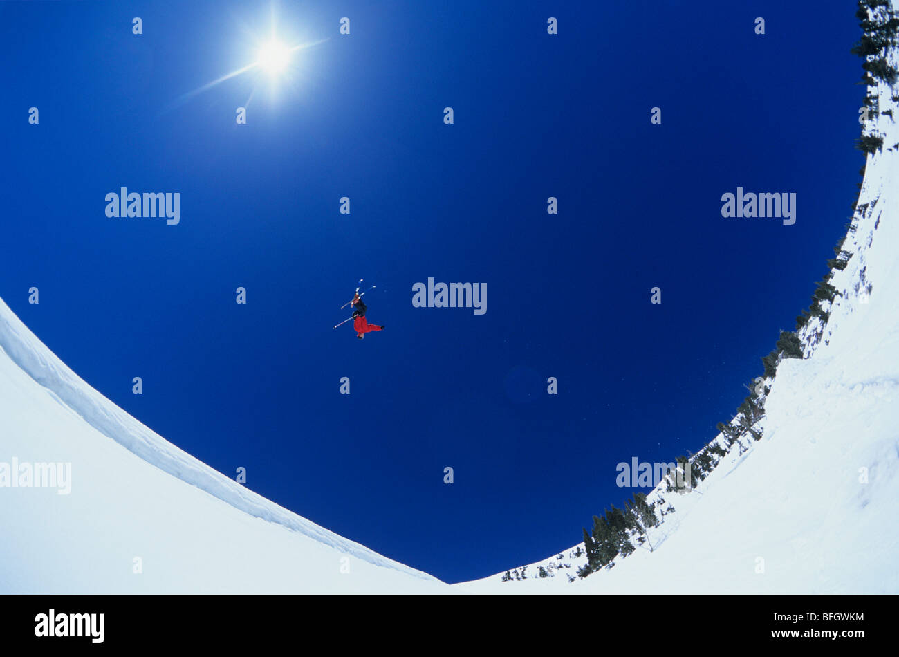 Skier performing flip on mountain Stock Photo - Alamy