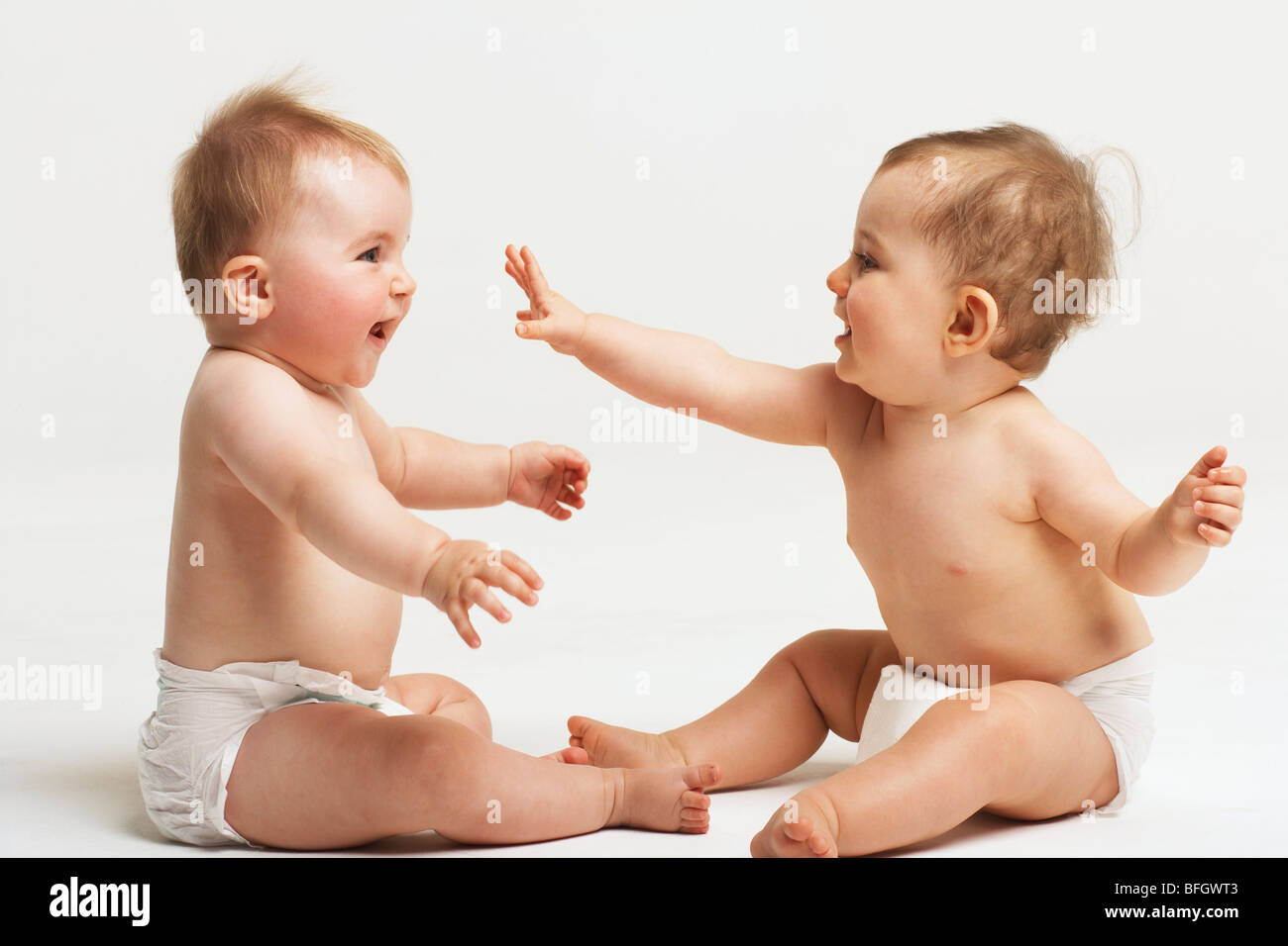 Two Babies Playing Stock Photo - Alamy