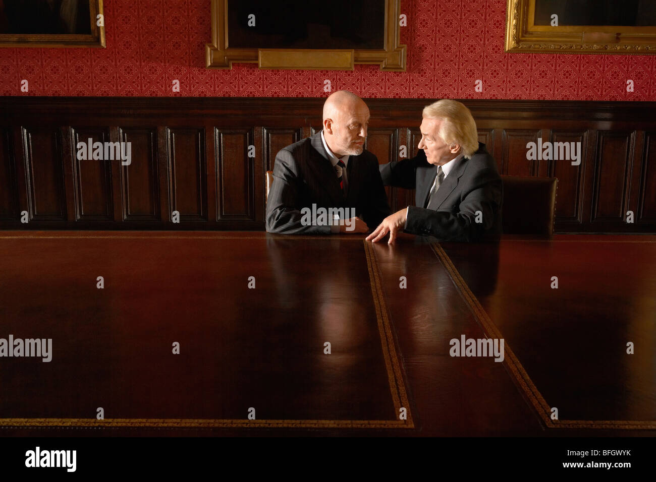 Two Men Talking in Conference Room Stock Photo - Alamy