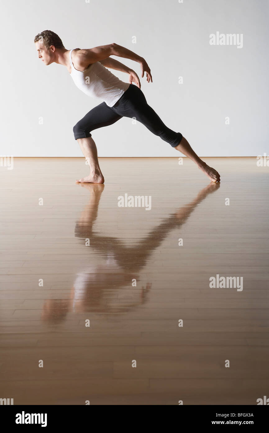Ballet Dancer leaning forward Stock Photo - Alamy