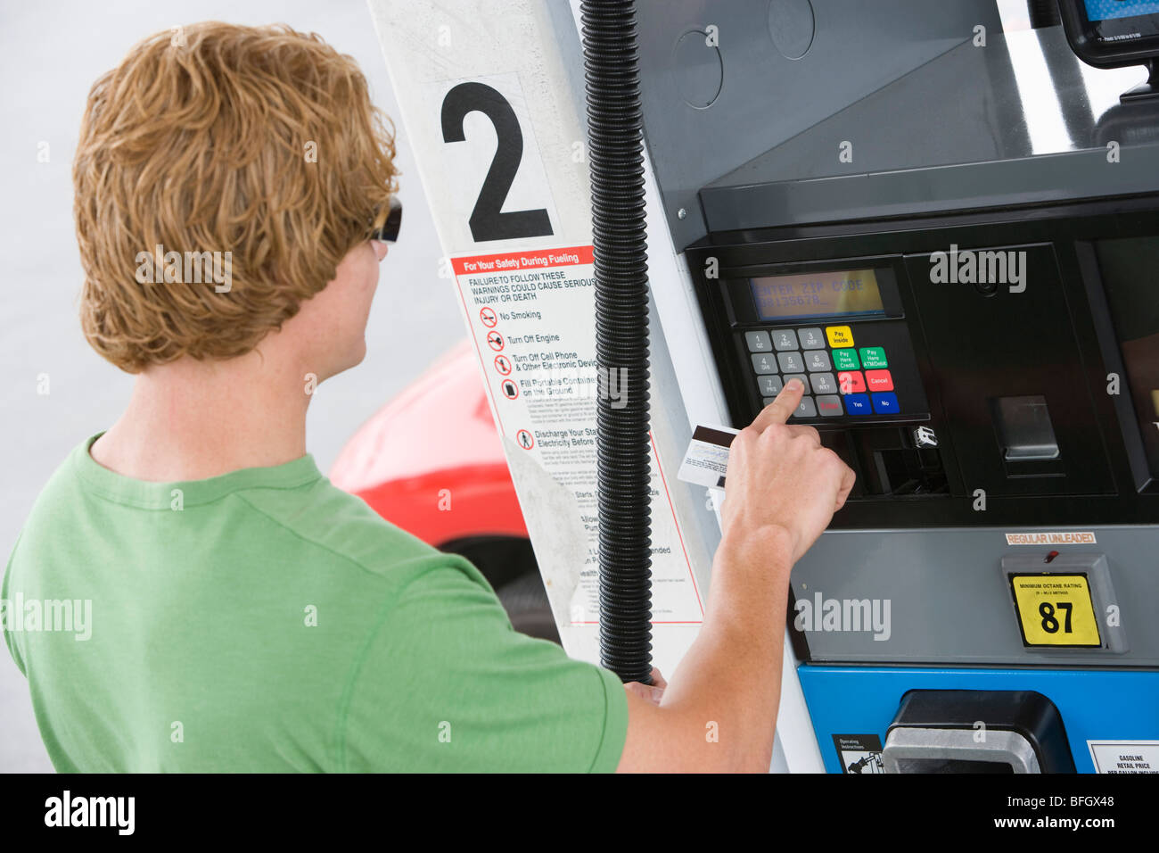 Man operating fuel pump payment kiosk Stock Photo - Alamy