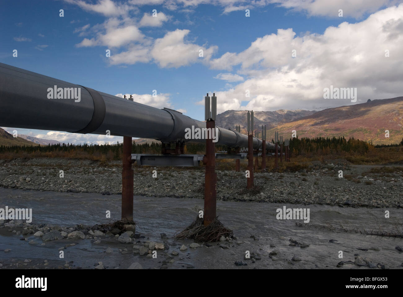 Alaskan Pipeline running through valley drainage. Alaskan Mountain ...